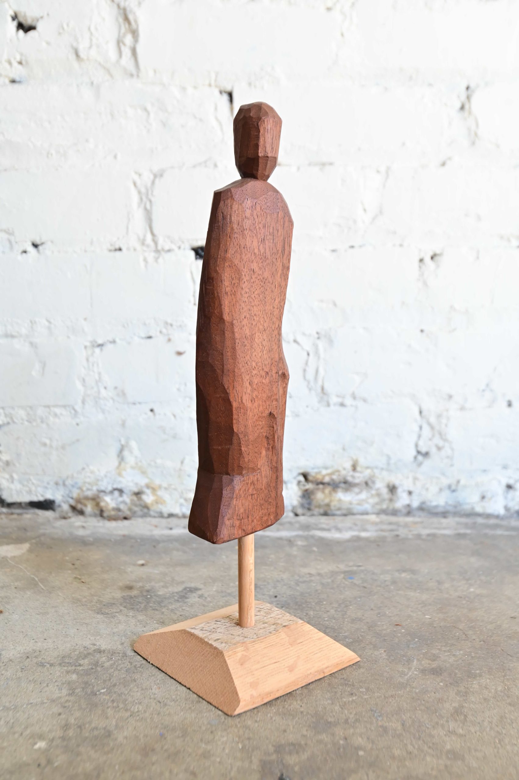 primitive minimal carved figure in walnut wood - commodity fetish